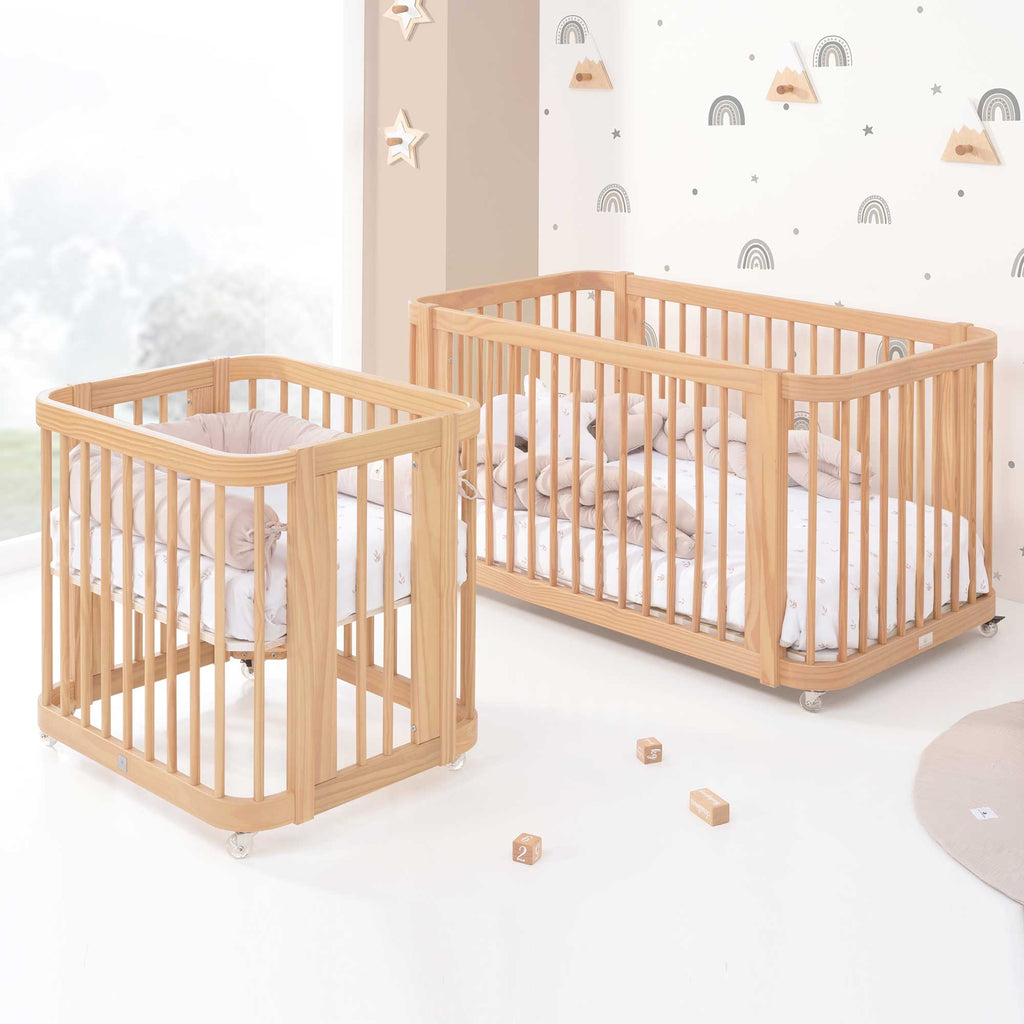 Minicuna pequeña y portátil con ruedas convertible en cuna grande
